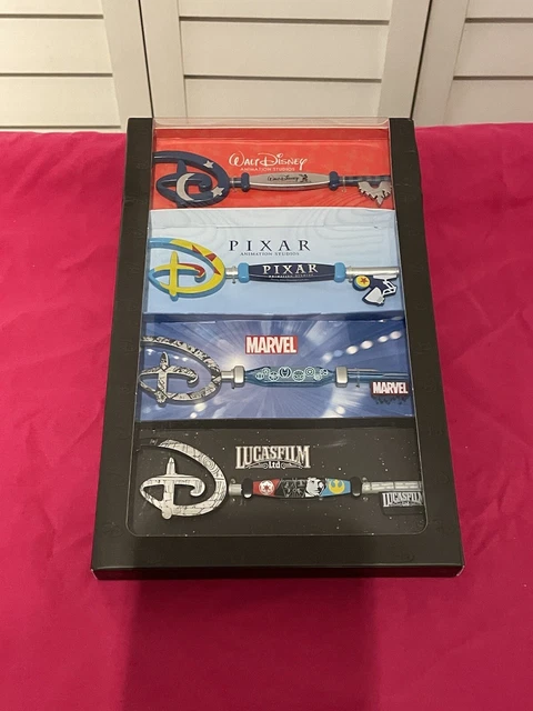 LOT DE 4 clés Disney Store Walt Disney Studios, Pixar Studios, Marvel ...