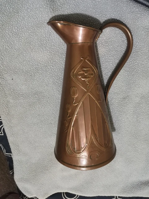 JOSEPH SANKEY & Son embossed copper jug, circa 1900, small dent on ...