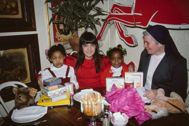 AMERICA CHILD ACTRESS Danielle Brisebois wearing a red blouse sits- Old ...