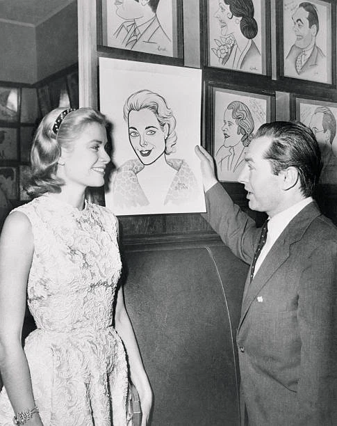 DON BEVAN SHOWING Caricature of Grace Kelly 1955 Photo - Artist Don ...