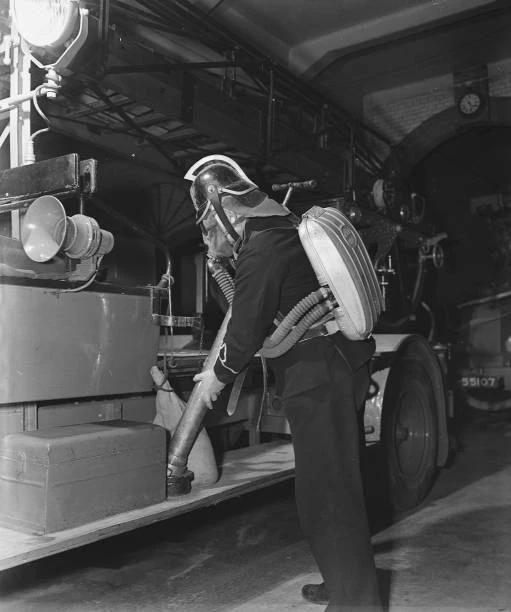 AMSTERDAM FIRE DEPARTMENT. Firefighter equipped with mask and oxyg- Old ...