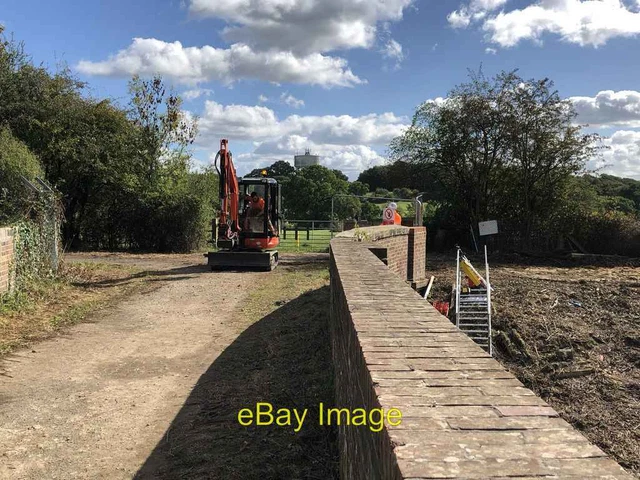 PHOTO 6X4 DIGGER crossing the railway bridge Burgess Hill The railway ...