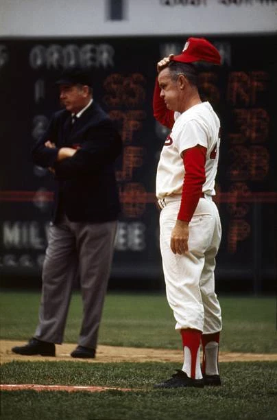WASHINGTON SENATORS FIRST base coach Nellie Fox relaying sign duri- Old ...