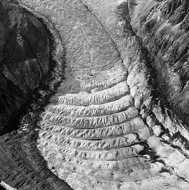 THE GERSTLE GLACIER develops scalloped surface ridges as it pushes ...