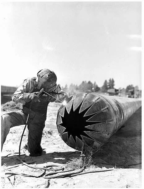 WORKER MAKING BULL nose plug casing pipe going under railroad track ...