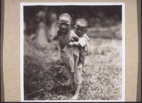 AN 'OLDER BROTHER' is taking care of a 'younger brother' early 1900s ...