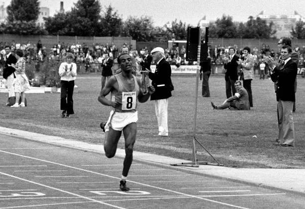 ETHIOPIAN MIRUS YIFTER coming home to win the 5000 metres Stev- 1977 ...