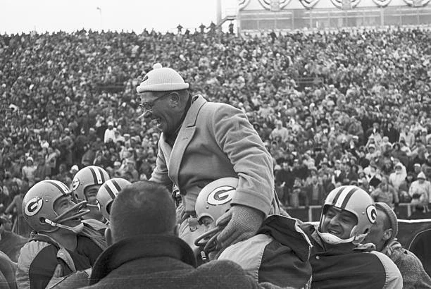 PACKER COACH VINCE Lombardi all grins as players start lift him- 1962 ...