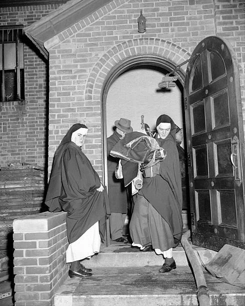 NUN CARRIES VESTMENTS from fire at St Elizabeth s Catholic Church ...