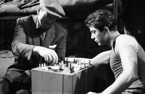 JOHN WAYNE AND Paul Anka playing chess on the set of the movie- 1962 ...