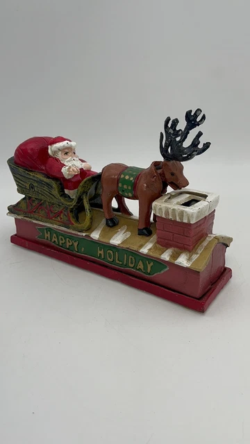 VINTAGE MECHANICAL HAPPY HOLIDAY Cast Iron Santa Claus & sleigh Coin ...