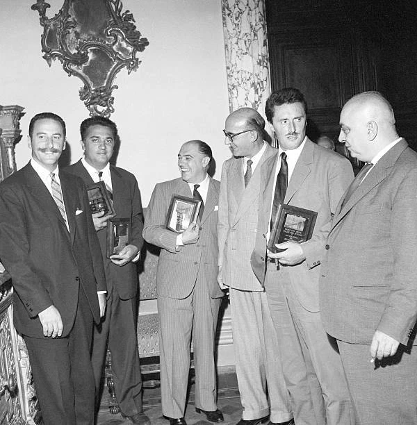 ITALIAN DIRECTOR FEDERICO Fellini, Italian producer Carlo Ponti 1957 ...