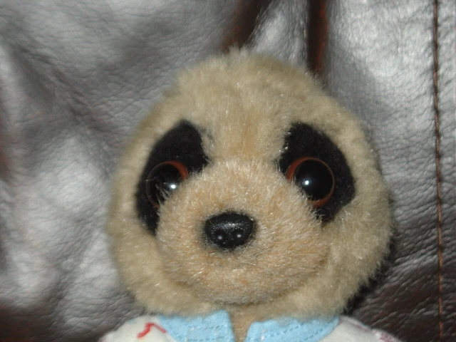 COMPARE THE MARKET Unboxed Meerkat plush soft toy Baby Oleg £8.00 ...