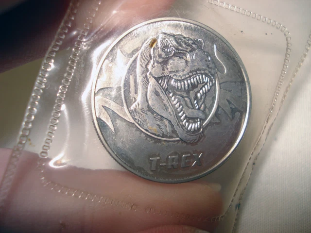 VNTG UNIVERSAL STUDIOS Amblin Jurassic Park T-Rex Dinosaur Silver Coin ...