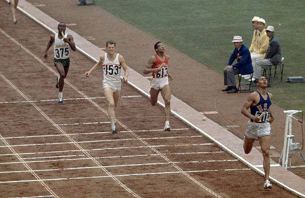AMERICAN ATHLETE HENRY Carr Crosses The Finish Line In First Place 1964 ...