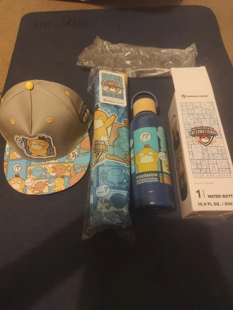 EUIC POKÉMON 2025 Exclusive Bundle -Psyduck Playmat, Grey Hat, Water ...