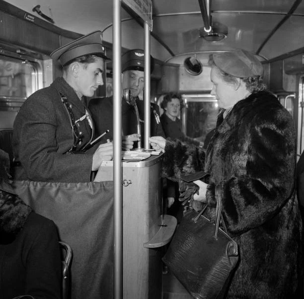 PASSENGER PAYS DESK conductor stamps ticket a tram Munich Germa- 1956 ...