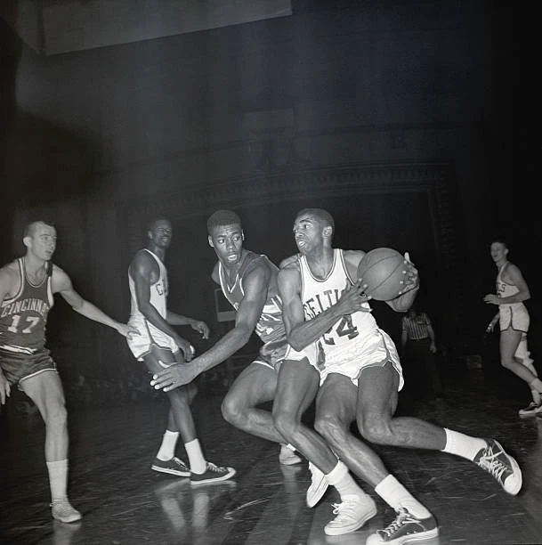 BOSTON CELTIC SAM Jones drives towards basket defended by Cinc- 1961 ...