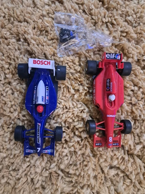 SCALEXTRIC BLUE BRIDGESTONE & Red Sonax Elf Minolta Formula 1 Cars £26. ...