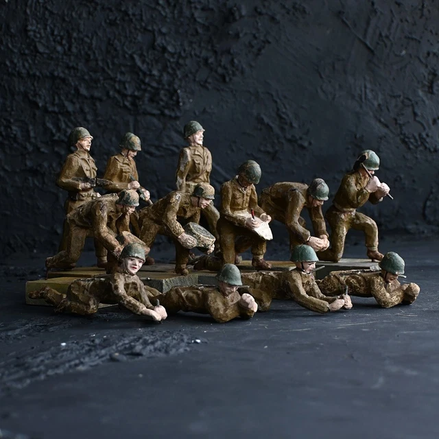A RARE COLLECTION of twelve mid 20th Century WW2 hand carved combat ...