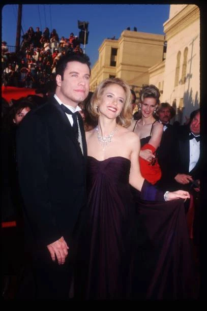 ACTOR JOHN TRAVOLTA stands with his wife Kelly Preston at the si .. Old ...