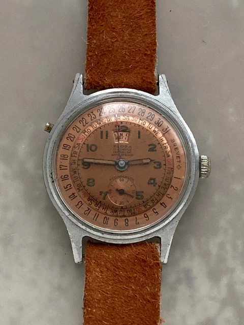 A RARE AND Superb Eloga Salmon Dial Triple Calendar Date-O-Graph ...