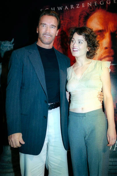 ARNOLD SCHWARZENEGGER AND Robin Tunney attend a press conference a ...