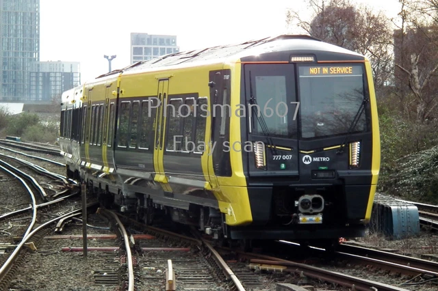 CLASS 777 STADLER 777007, 4 car EMU, in MerseyRail Yellow at Sand Hills ...