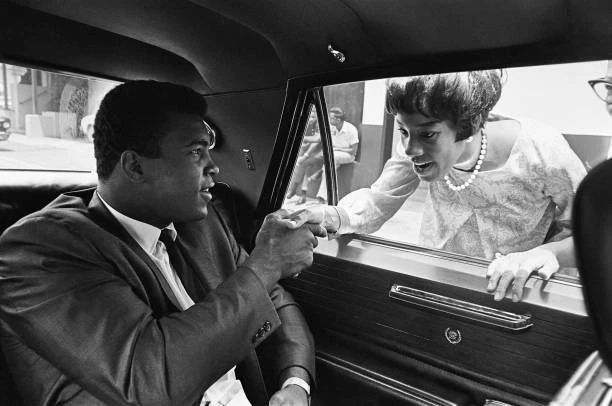 MUHAMMAD ALI SHAKES a female's hand from his car 31st August 1967 Old ...