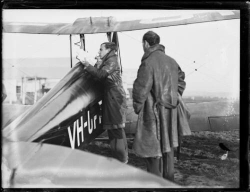 JIMMY MOLLISON READING next to his plane on his departure for Engl- Old ...