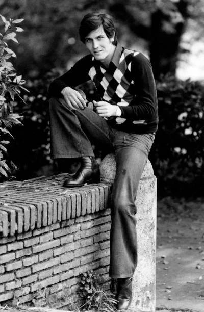 ITALIAN ACTOR PAOLO Giusti smiling seated on a column Rome 1970s Old ...