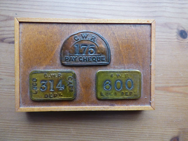 THREE GWR RAILWAY Pay Cheque Tokens, mounted on wooden plaque. £20.00 ...