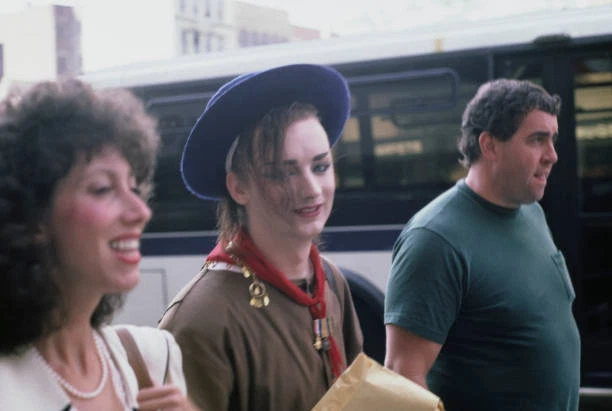 BOY GEORGE A woman walking along a street an location USA 1983 Old ...