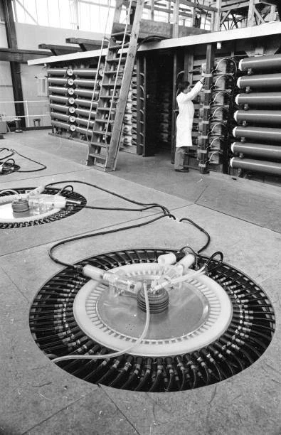 PHYSICIST DAVID DANCY checks a triggering mechanism a Thetatron- 1964 ...