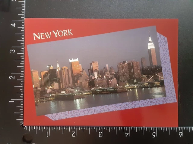 POSTCARD MANHATTAN SKYLINE Buildings at dusk Hudson River New York £3. ...