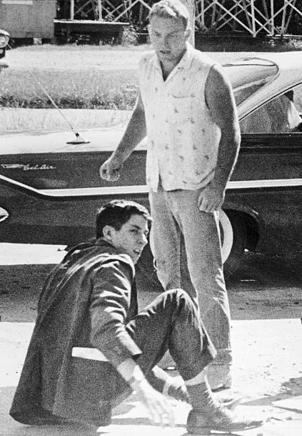 FREELANCE REPORTER TOM Hayden tries pick himself up as assaila- 1961 ...