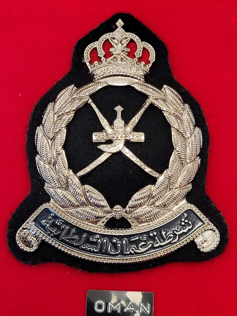 OBSOLETE DEFUNCT OMAN Police Cap Badge On Felt - Red Enamel Crown £59. ...