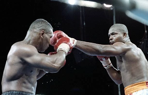 DONOVAN RUDDOCK THROWS A Punch Against Mike Tyson Old Boxing Photo $9. ...