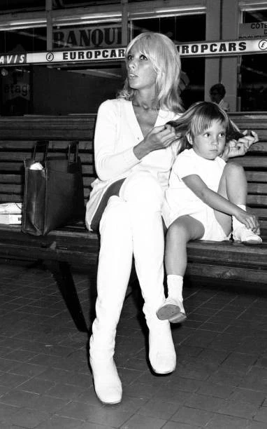DANY SAVAL WITH his daughter Emilie in an airport hall in 1969 Old ...