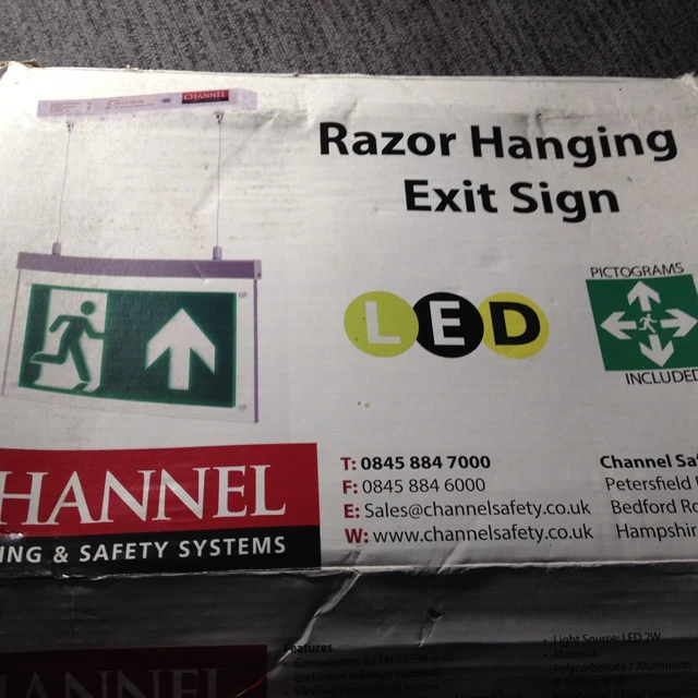 A CHANNEL RZ/M3/LED/H EMERGENCY Exit Sign Hanging with other signs £45. ...