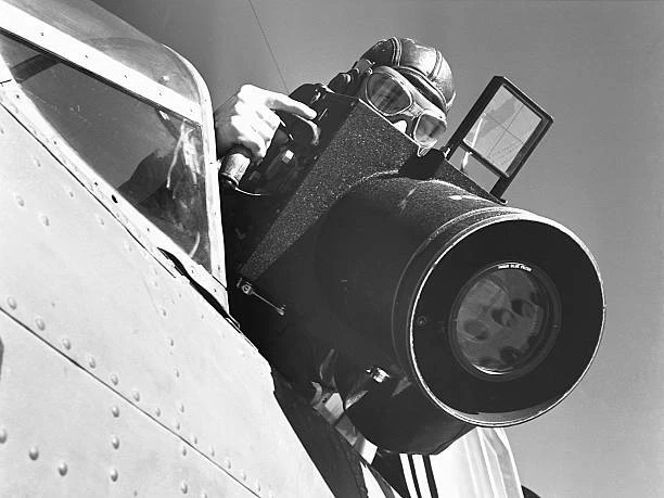 NAVY PHOTOGRAPHER READIES his reconnaissance camera for a shot fro- Old ...
