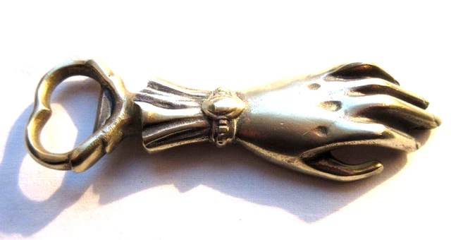 DÉCAPSULEUR ART DÉCO, Vintage, bronze doré: Main gantée avec bracelet ...