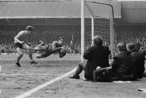 LEICESTER CITY'S GOALKEEPER Peter Shilton goes up to clear fro- 1971 ...