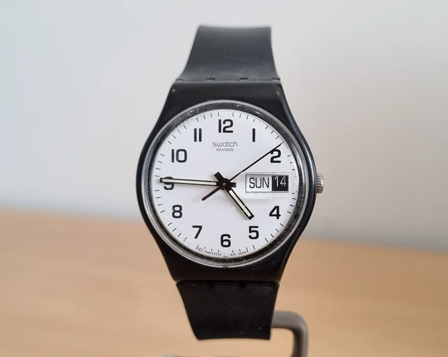 SWATCH BLACK PLASTIC cased, white dial day date Swiss made quartz watch ...