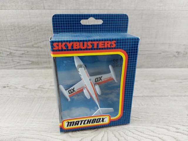 MATCHBOX SKYBUSTERS SB-1 Learjet QX-Press Livery Model Aircraft 1987 (2 ...