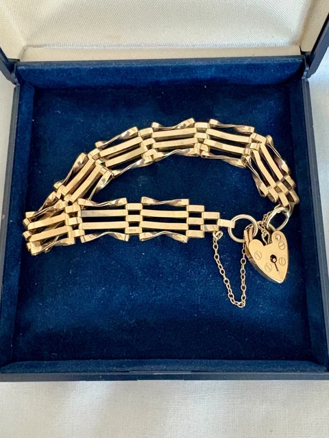 9CT GOLD FOUR bar gate bracelet with heart lock and safety chain £343. ...