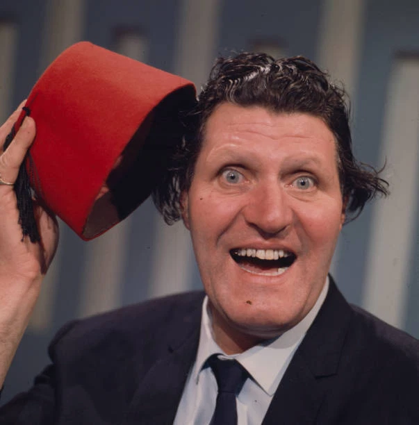 COMEDIAN AND MAGICIAN Tommy Cooper Posed Lifting His Red Fez H 1960s ...