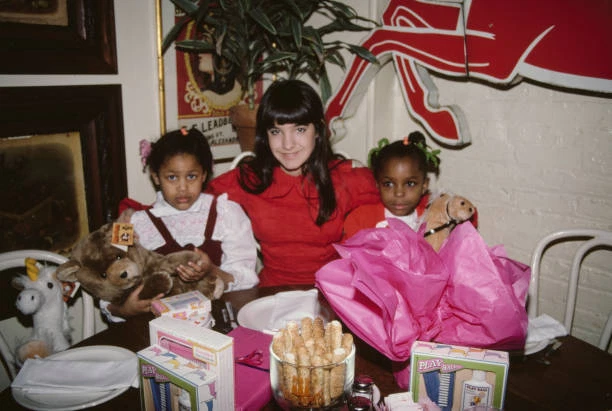 AMERICA CHILD ACTRESS Danielle Brisebois wearing a red blouse sits- Old ...