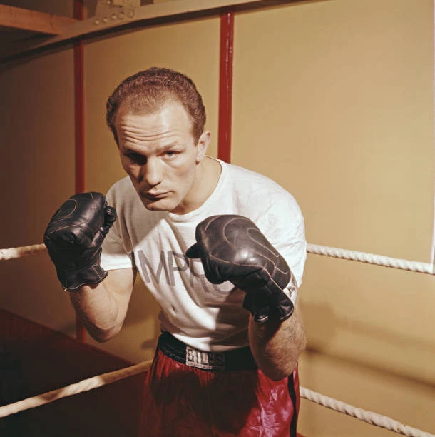 ENGLISH HEAVYWEIGHT BOXER Henry Cooper pictured during trainin- 1960s ...