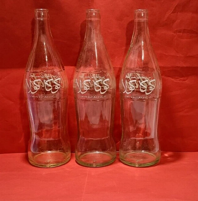ONE LINE WRITING : three Old Coca-Cola glass bottle from 1986, Arabic ...